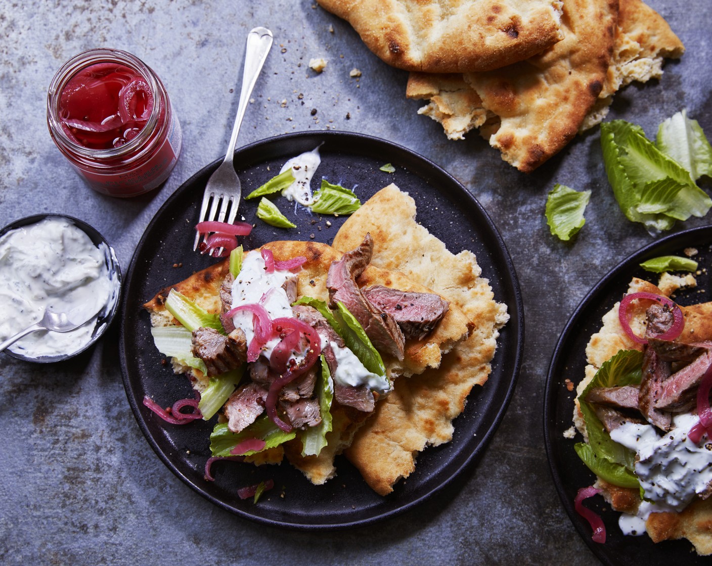 Meltingly tender lamb flatbreads with tzatziki and pickles Recipe | M&S