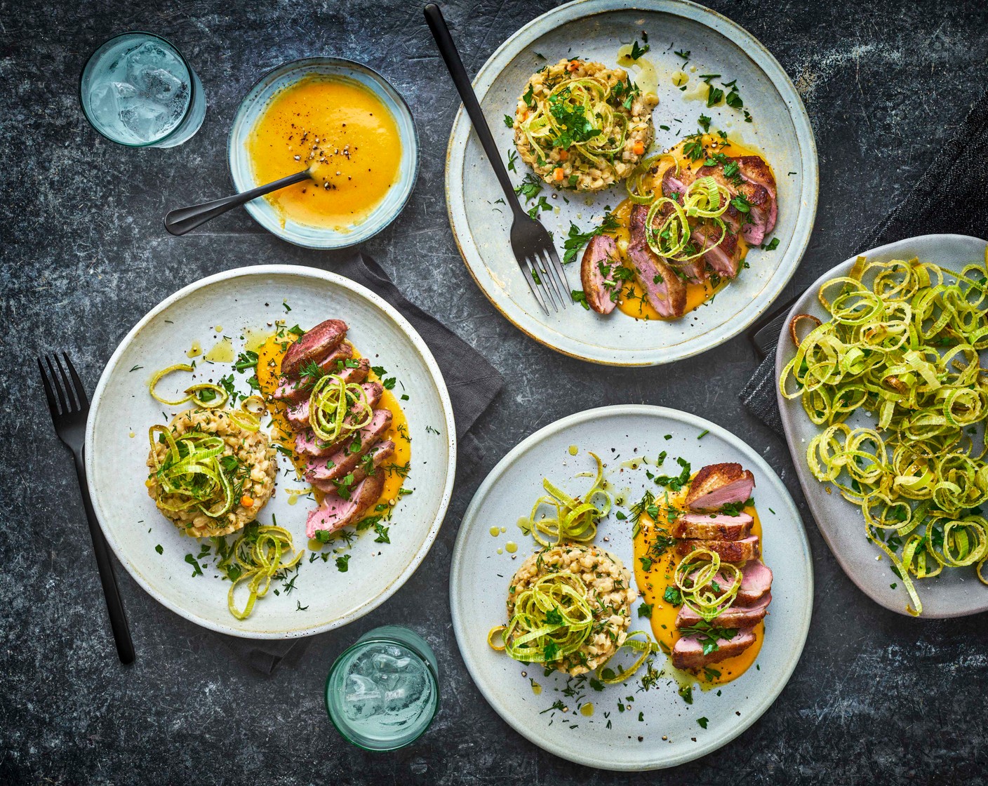 Seared duck with apricot sauce, herby pearl barley and crispy leeks ...